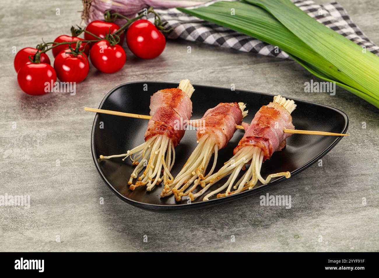 Grilled enoki mushroom with bacon roll wrap Stock Photo - Alamy