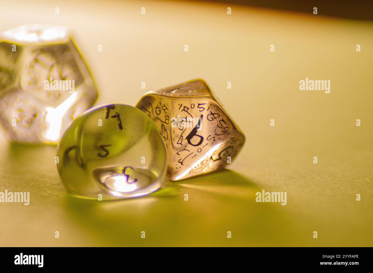 close-up view of three dice of different shapes for board games and ...