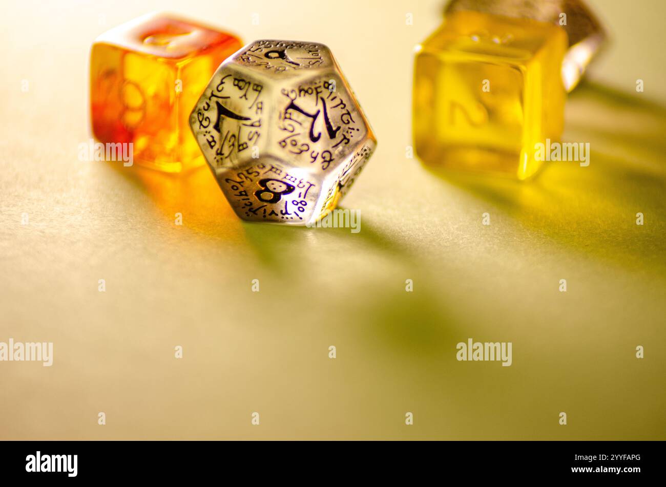 close-up view of three dice of different shapes for board games and ...