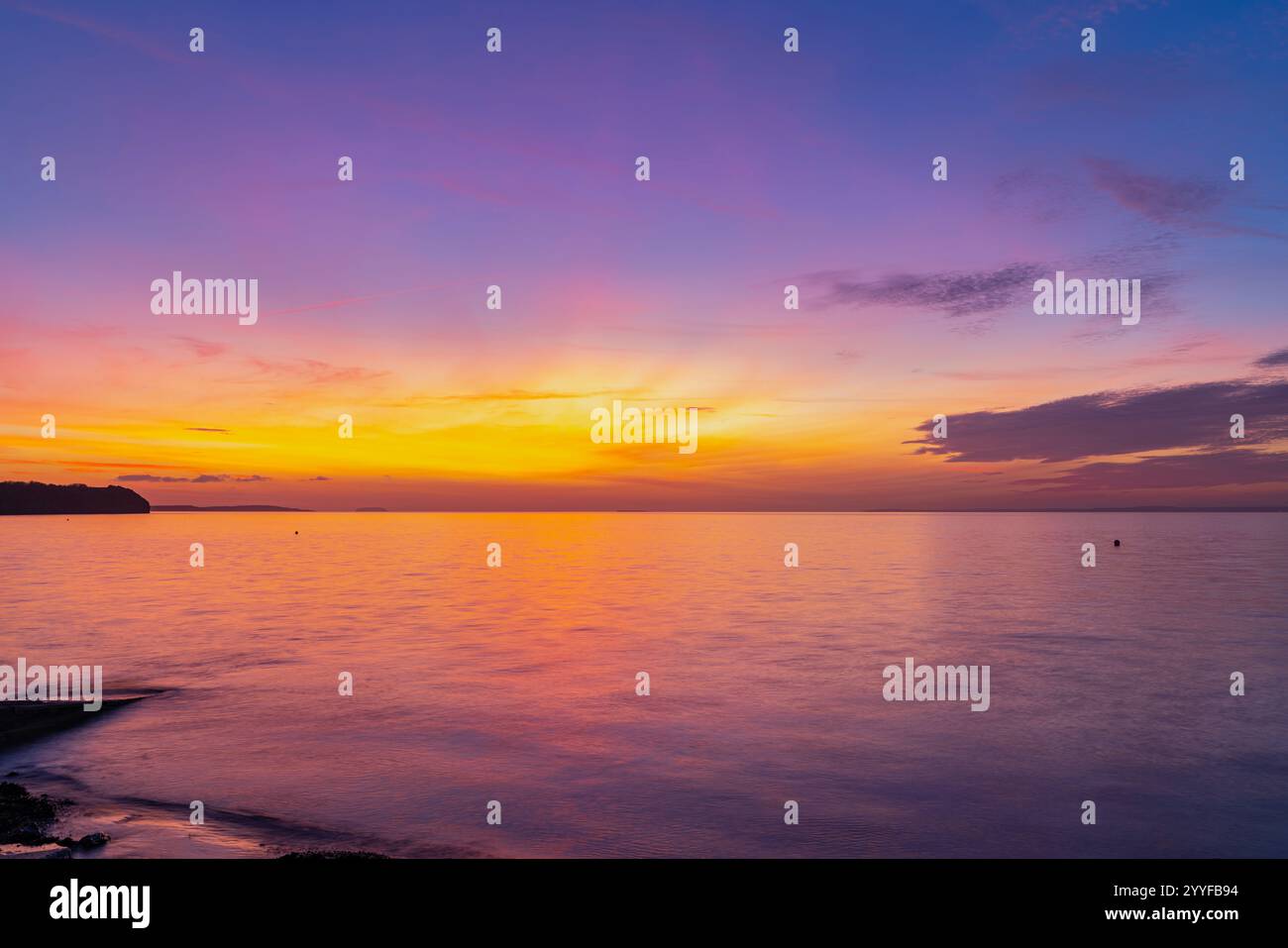 The reddish orangey colour along the horizon and the pink above ...