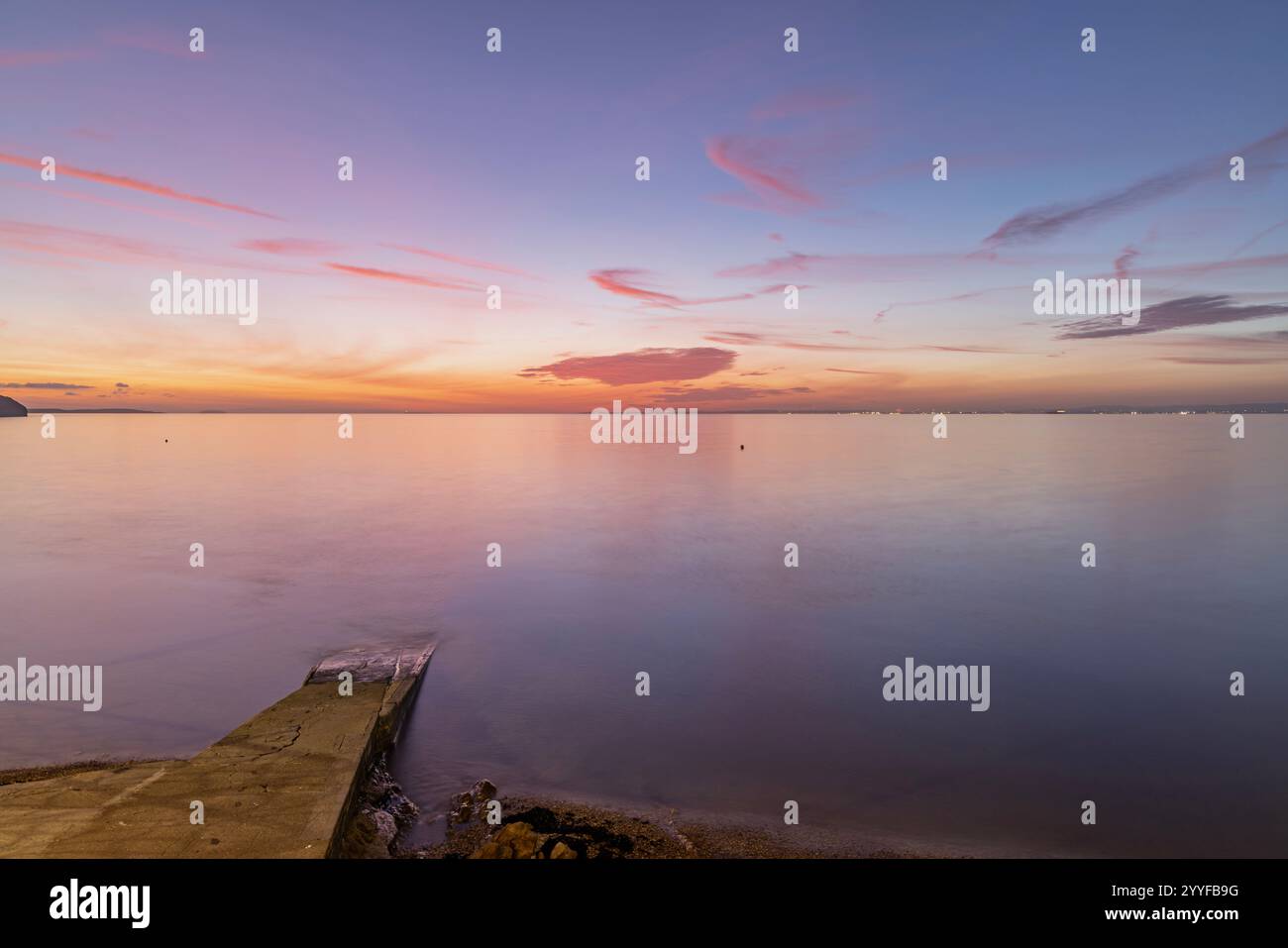 The reddish orangey colour along the horizon and the pink above ...