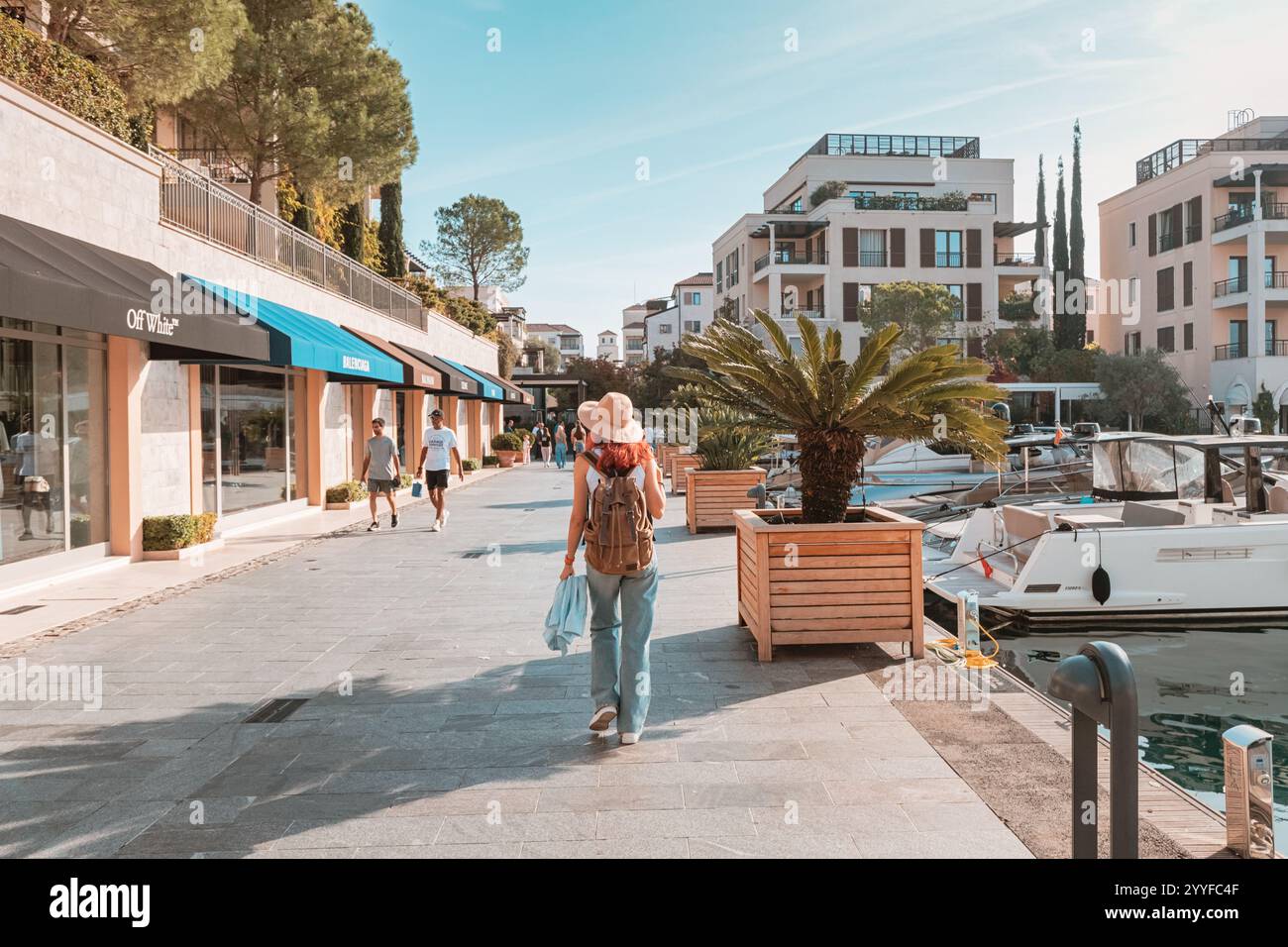 26 October 2024, Tivat, Montenegro: Tourist walking near luxury shops ...
