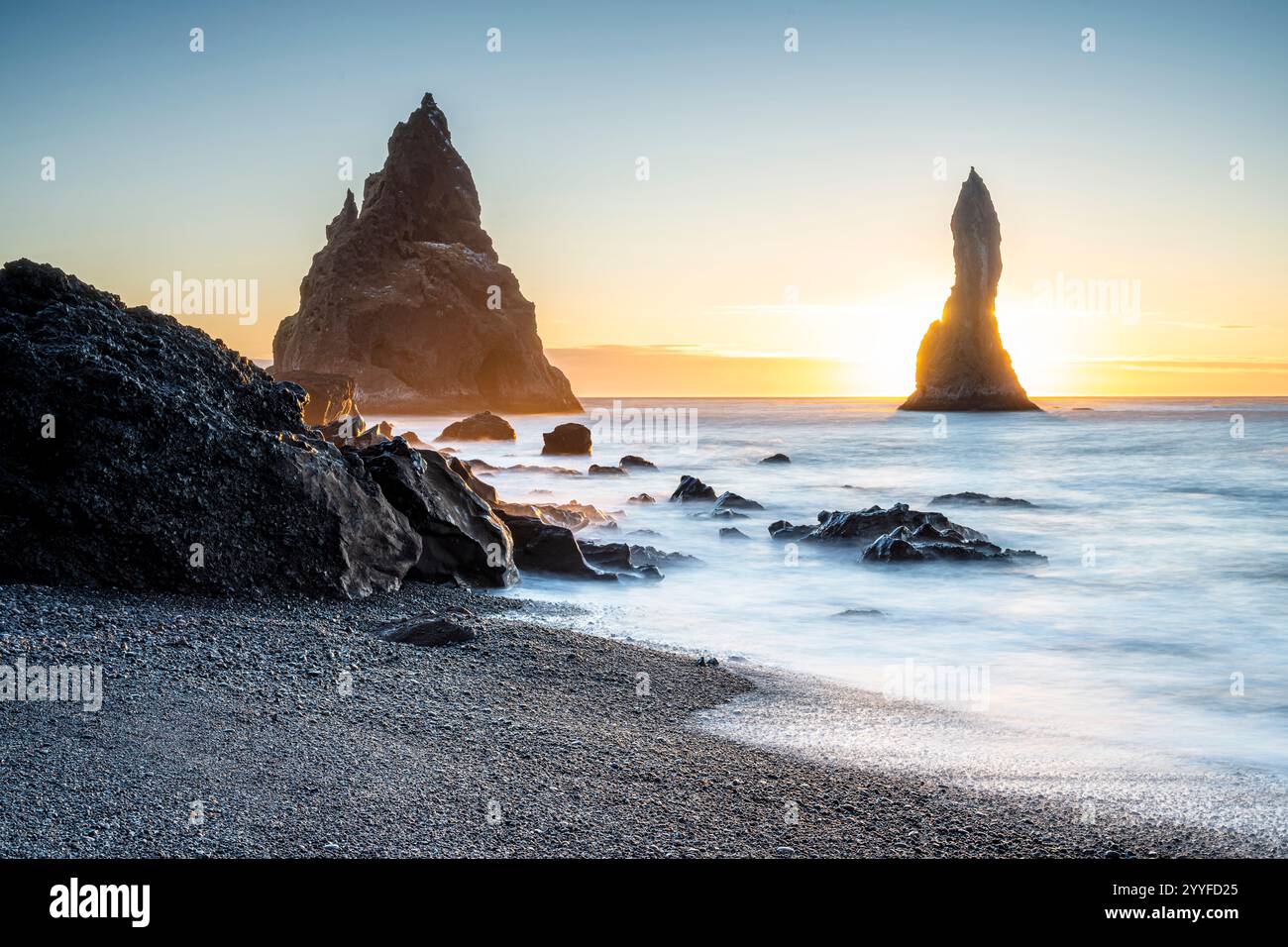 View of Black Sand Beach of Reynisfjara and Reynisdrangar Sea stacks in ...