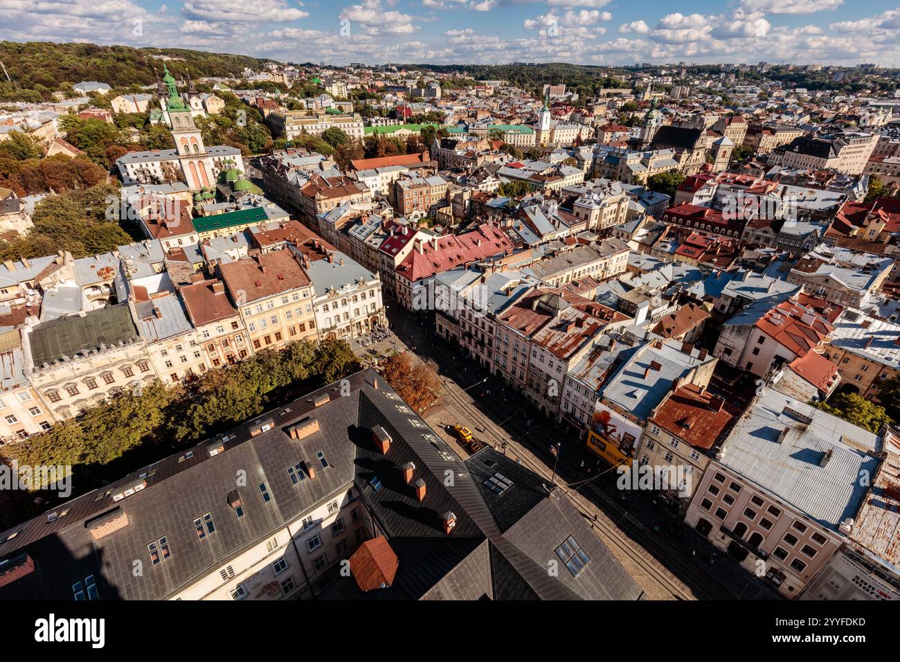 A city view from above with many buildings and a few people walking ...