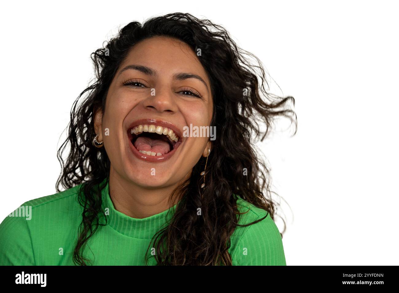 Studio portrait of a cheerful young latin woman laughing with open ...