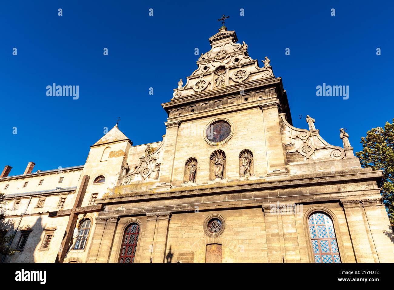 A large building with a steeple and a clock tower. The building is old ...