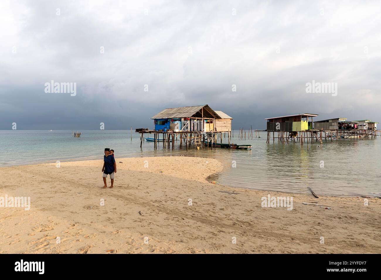 Traditional bajau laut village, houses on stilts on a remote sandbank ...