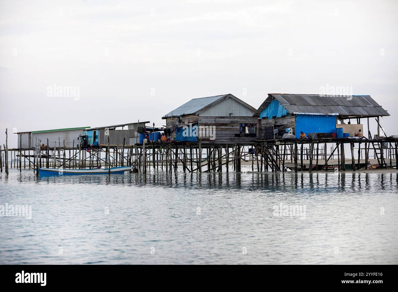 Traditional bajau laut village, houses on stilts on a remote sandbank ...