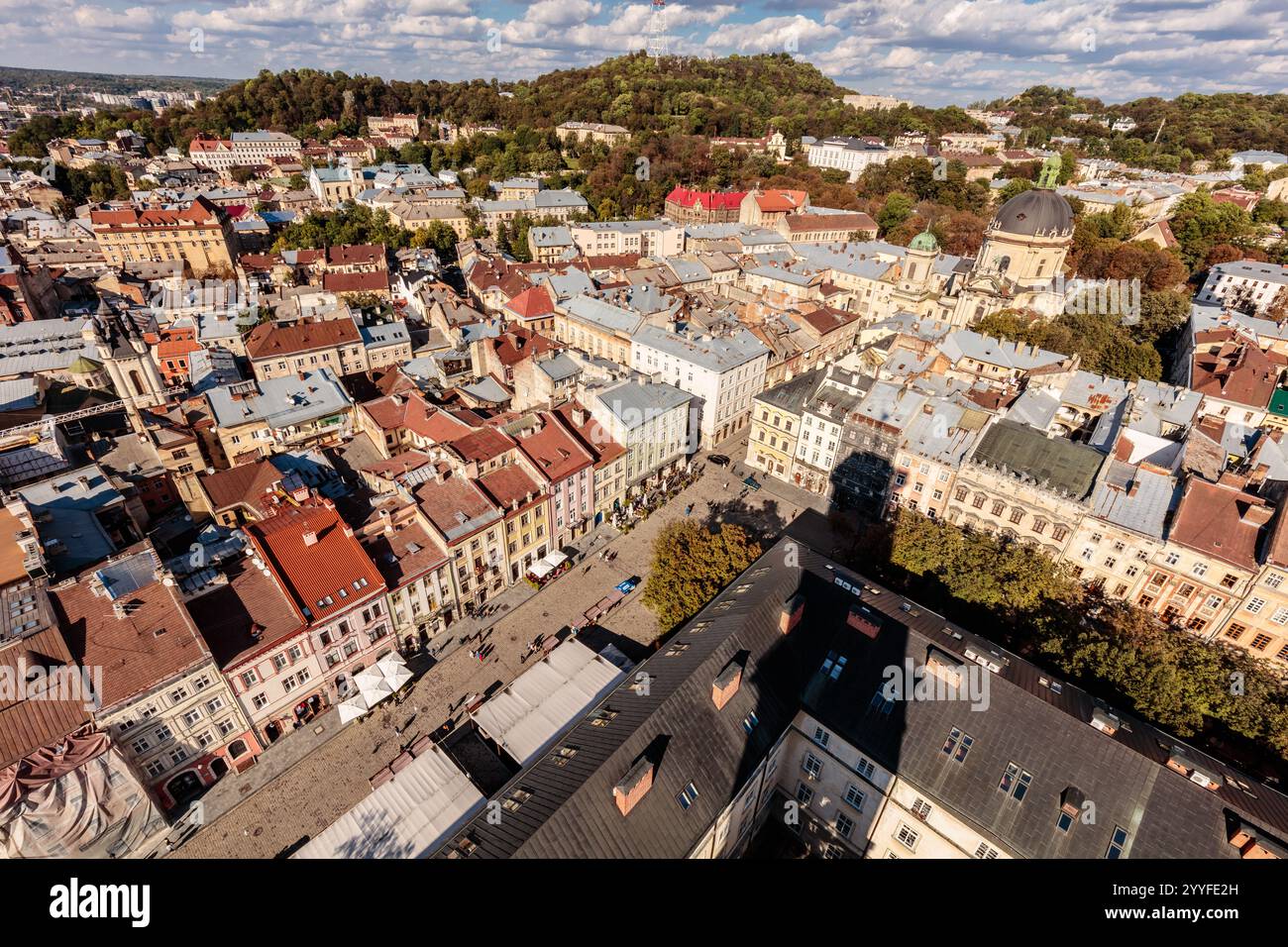 A city view with many buildings and a large square. The buildings are ...