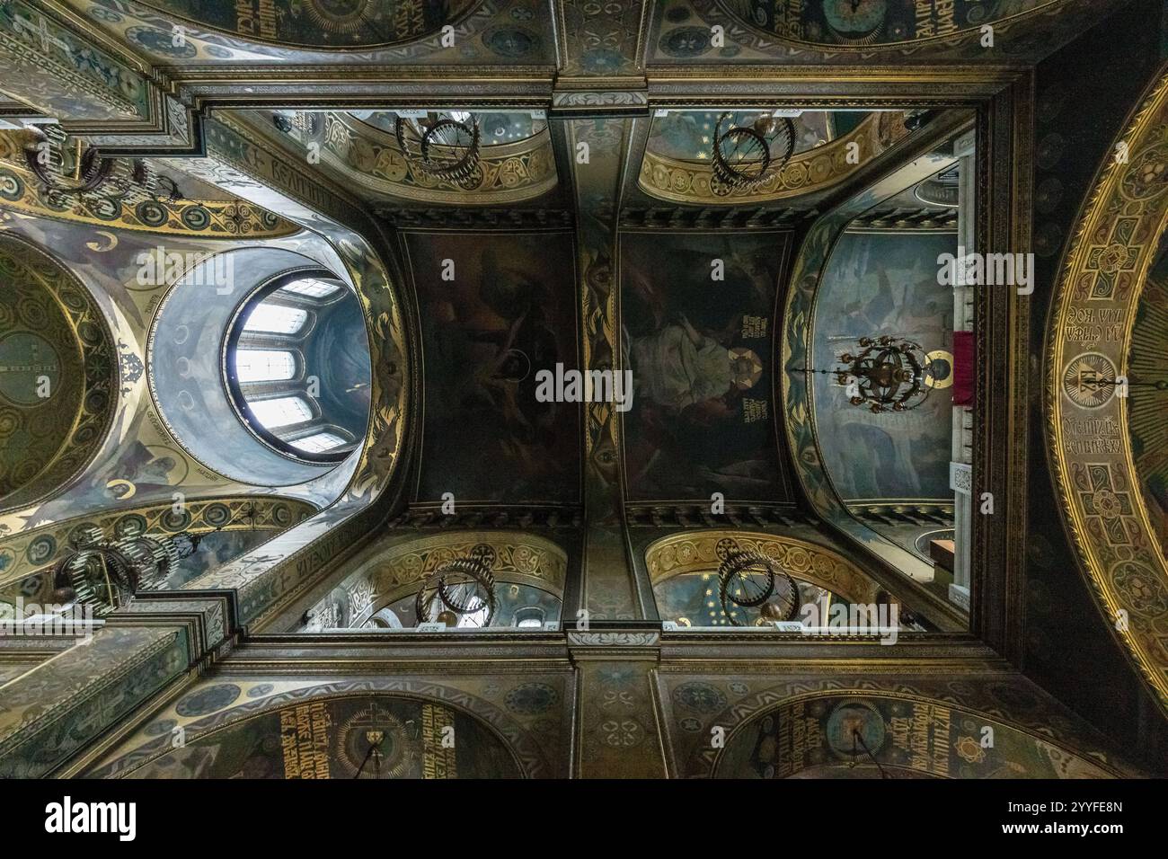 The inside of a church with gold and blue decorations. The gold is on ...