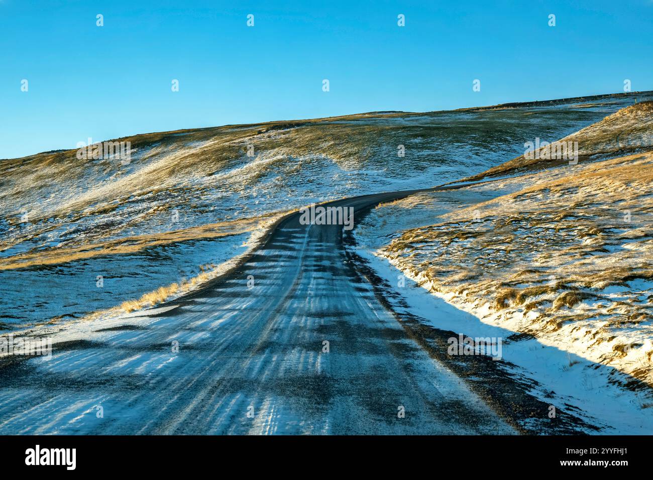 Ice and snow covered Icelandic roads with sideways full of snow the ...