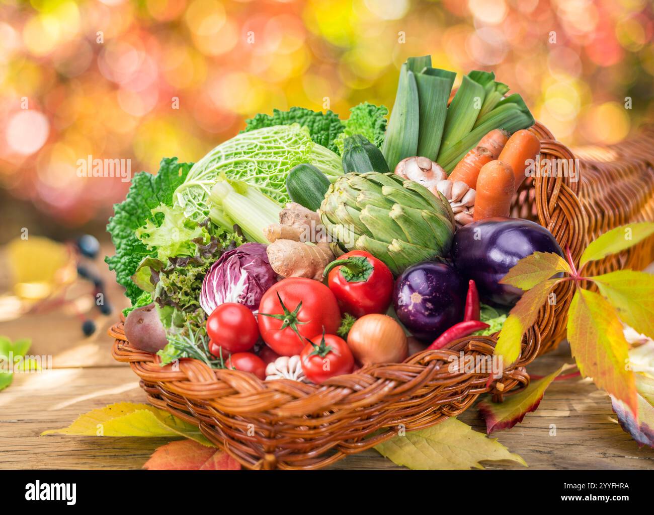 Wicker cornucopia of plenty fruits and vegetables at bright colorful ...
