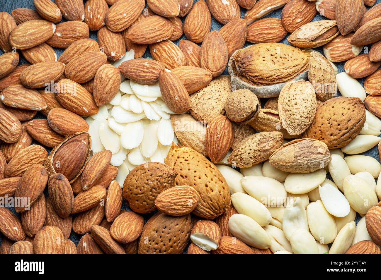 Large group of different almond nuts close-up. Food background Stock ...