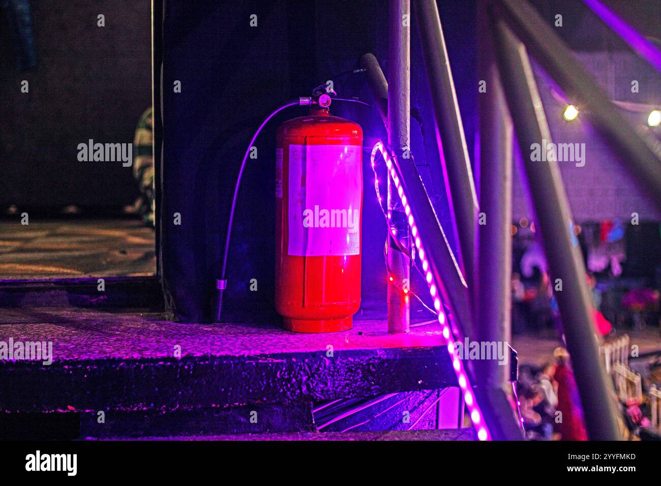 fire extinguisher stands on the stairs at the dance tournament. Safety ...