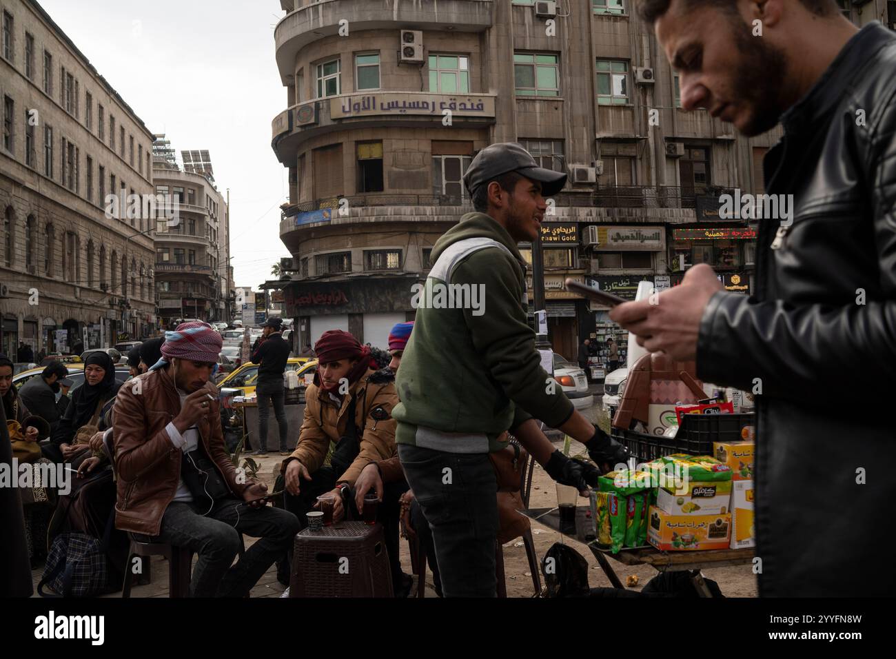 People smoke and drink tea at the Marjeh square in Damascus, Syria ...