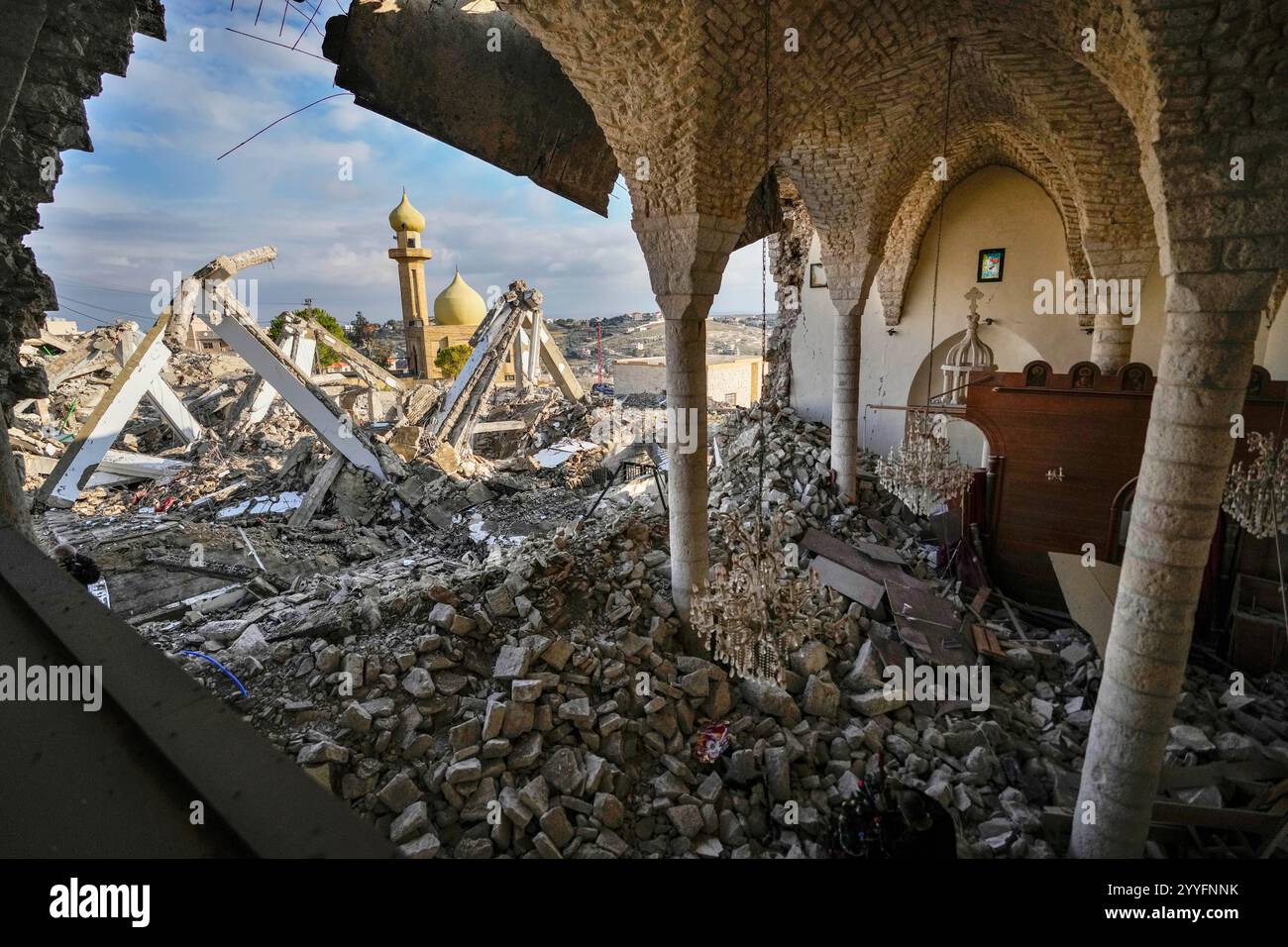 A mosque is seen from St. George Melkite Catholic Church, that was ...