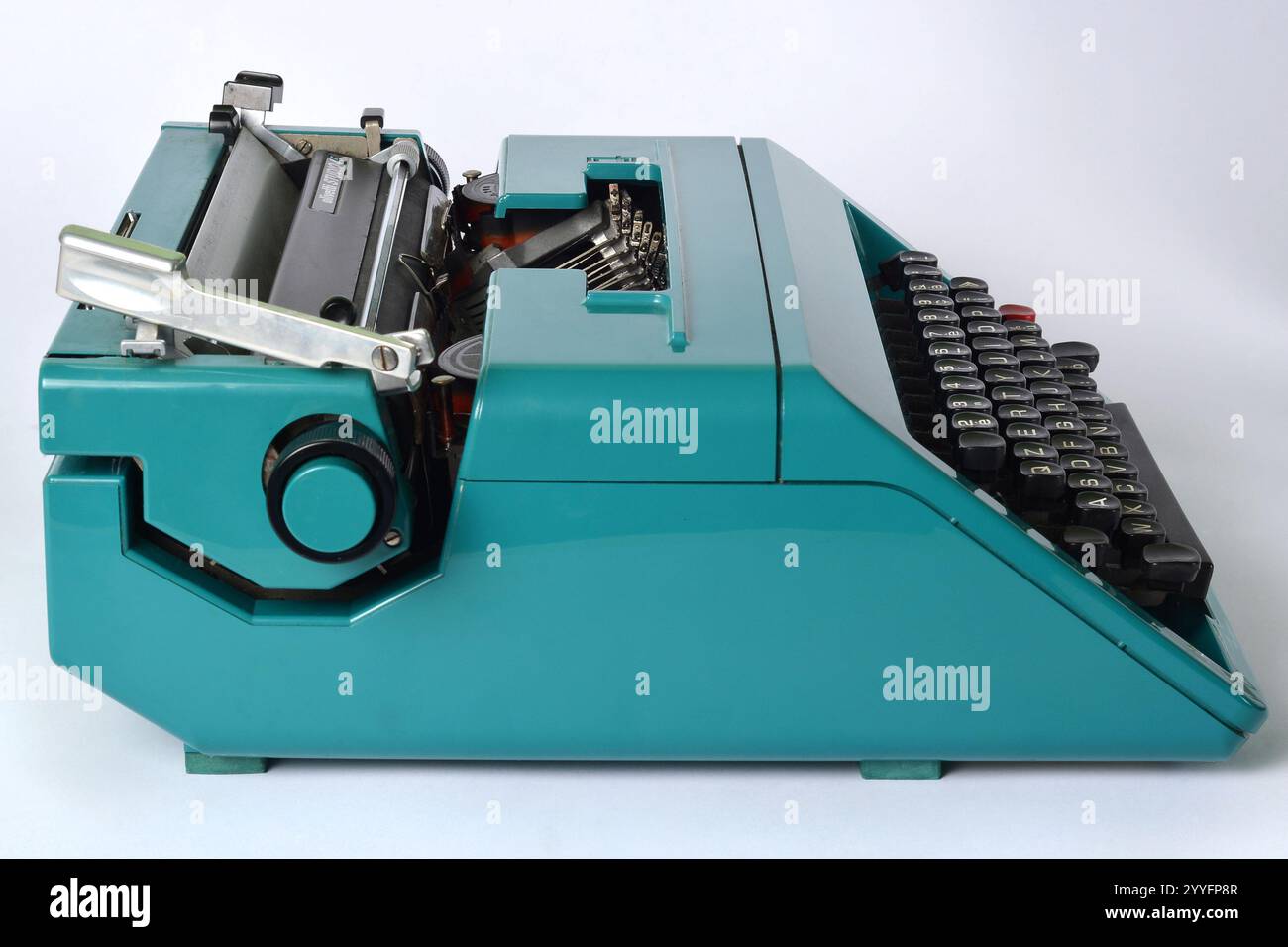 Turin, Piedmont, Italy - 05-15-2024- An old green mechanical typewriter ...