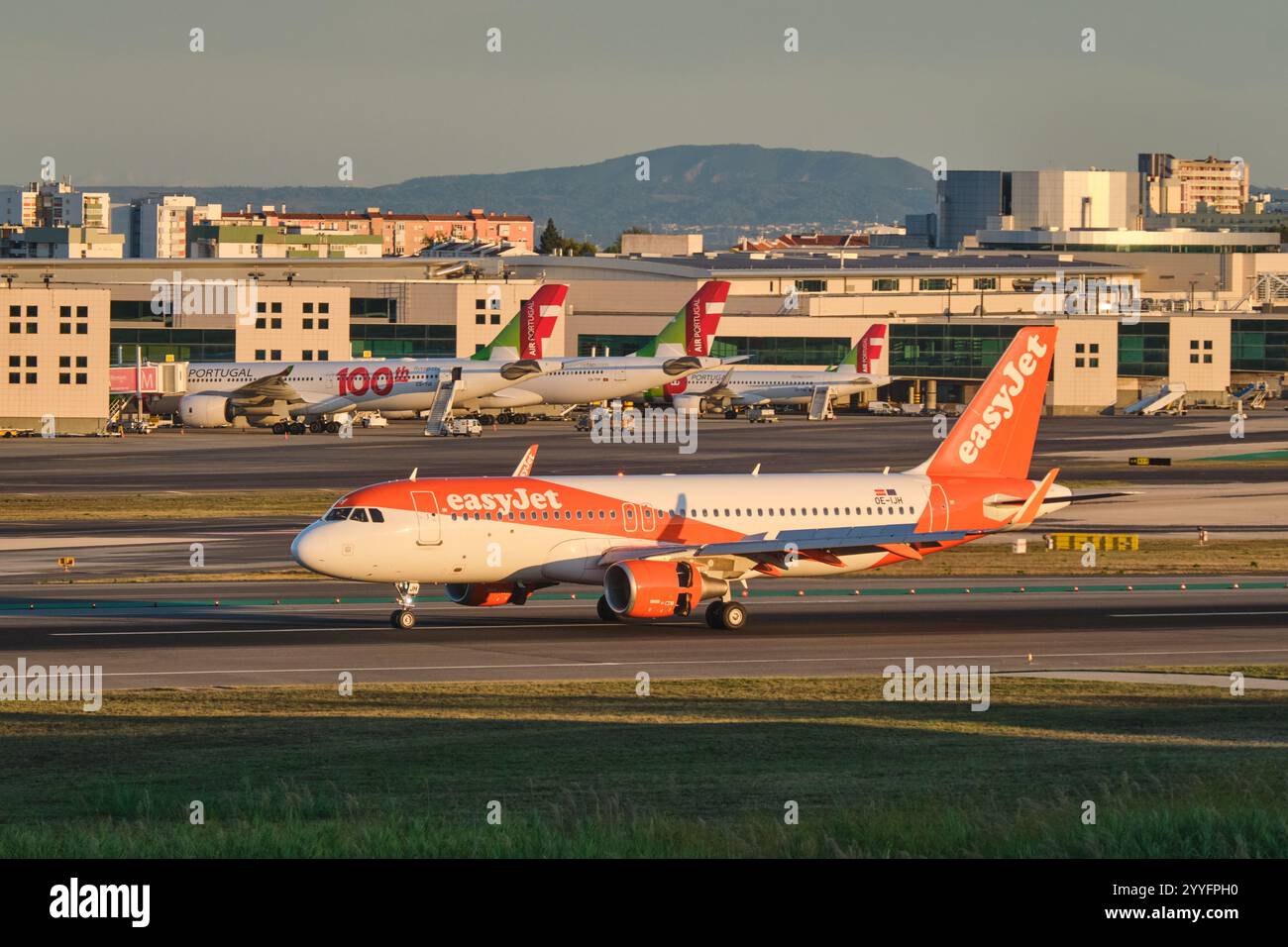 easyJet Airbus A320-214 passenger plane taxi on runway in Humberto ...