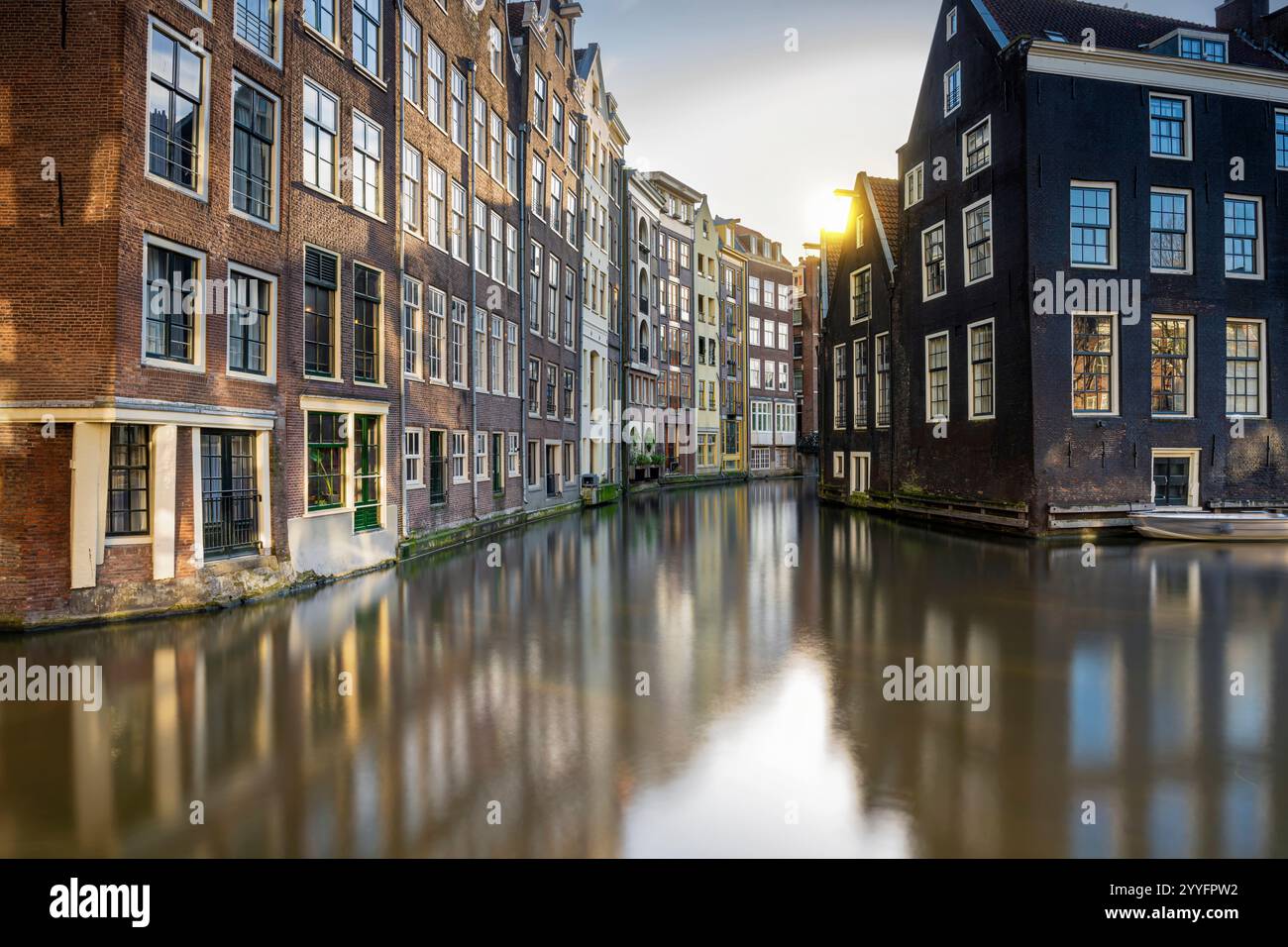 Panoramic view of facades of colorful Amsterdam houses reflecting in ...