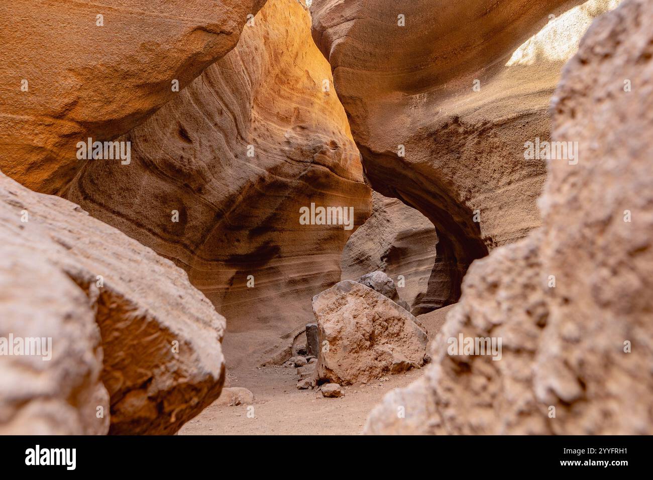 A cave with a hole in the middle. The cave is dark and the hole is ...