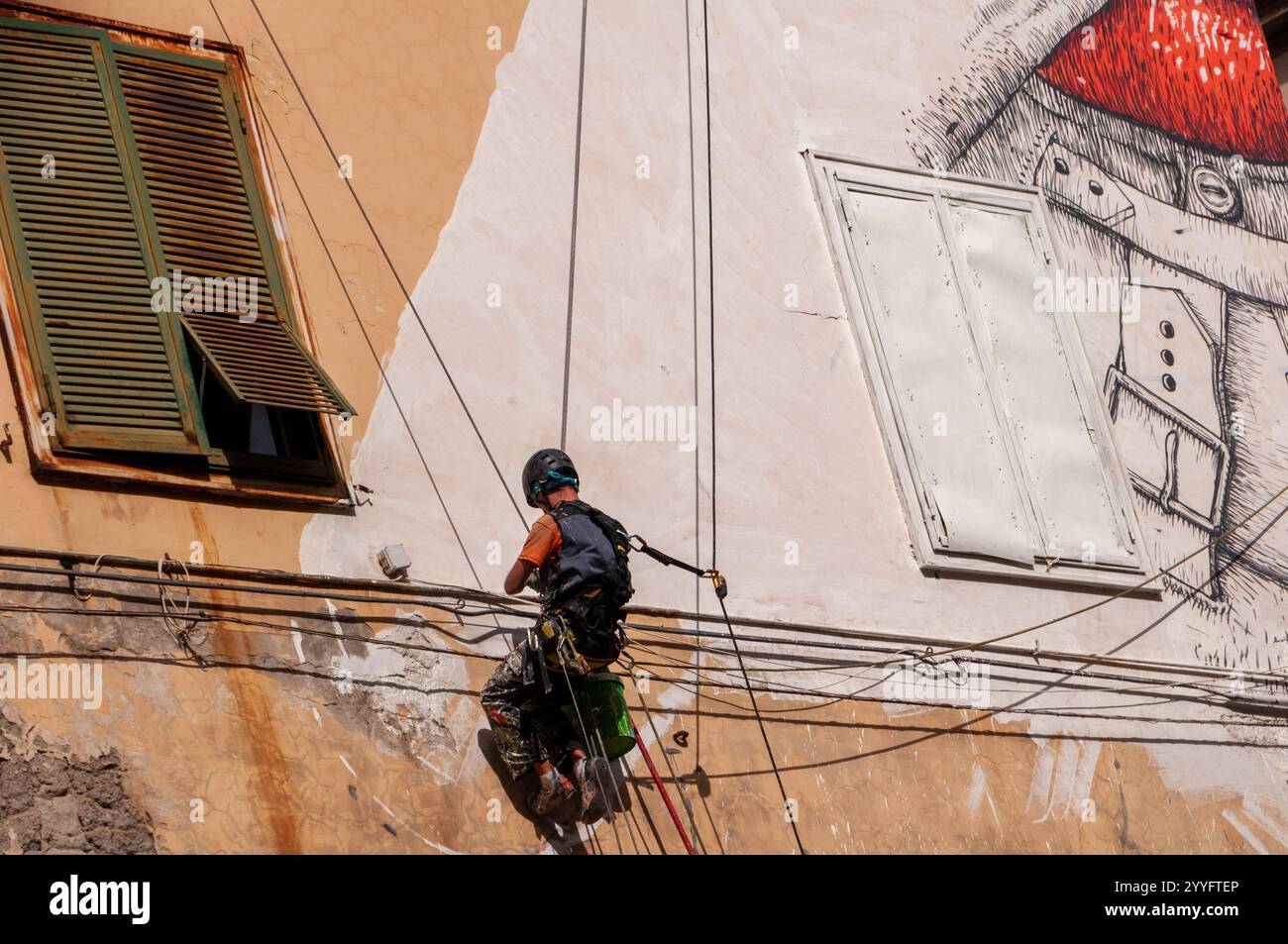 Street art by the famous artist Blu drawn live on the facade of the ...