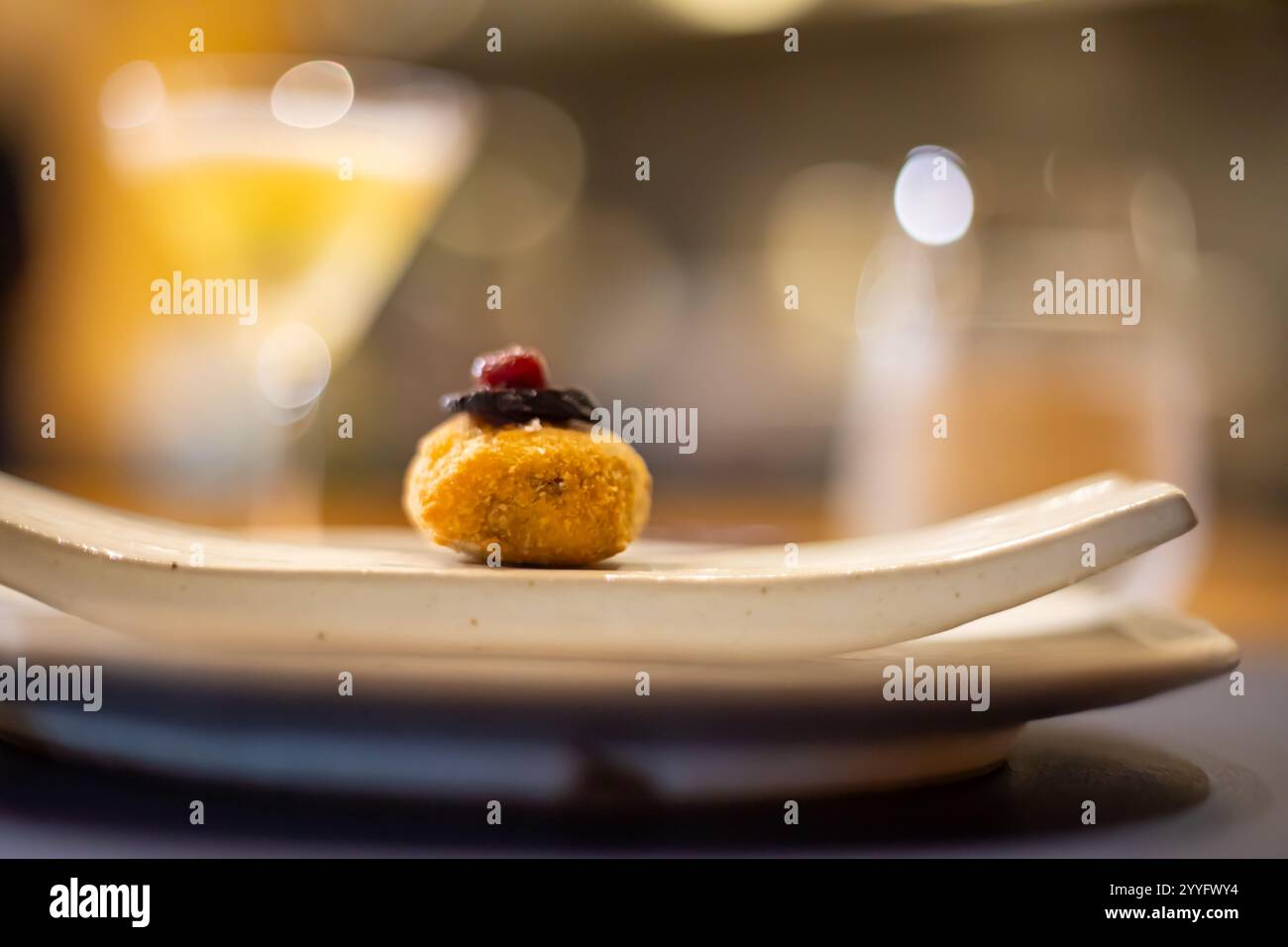 Elegant bite sized appetizers arranged on a plate, exquisite dish ...