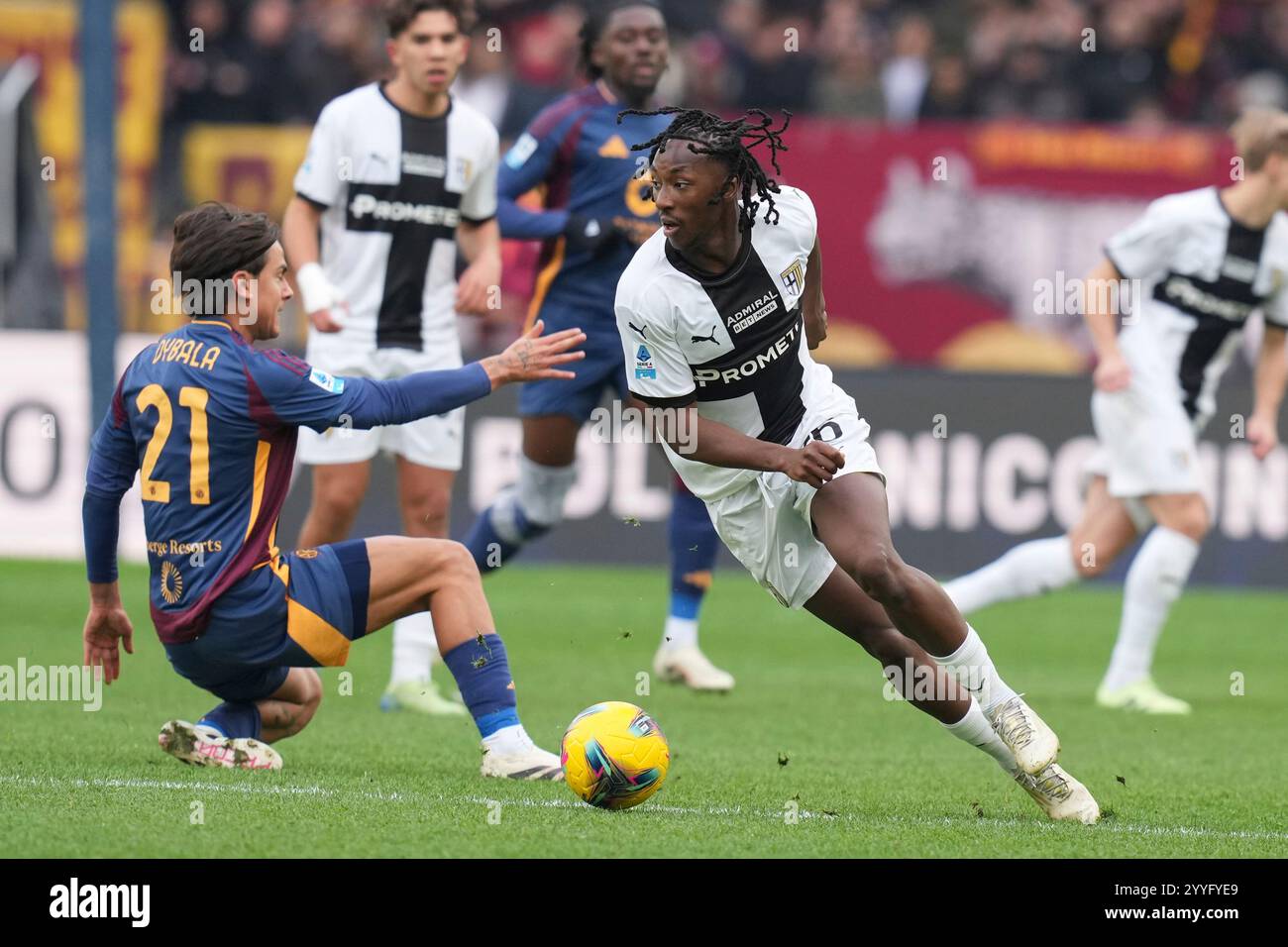 Parma's Woyo Coulibaly, right, takes on Roma's Paulo Dybala during the ...