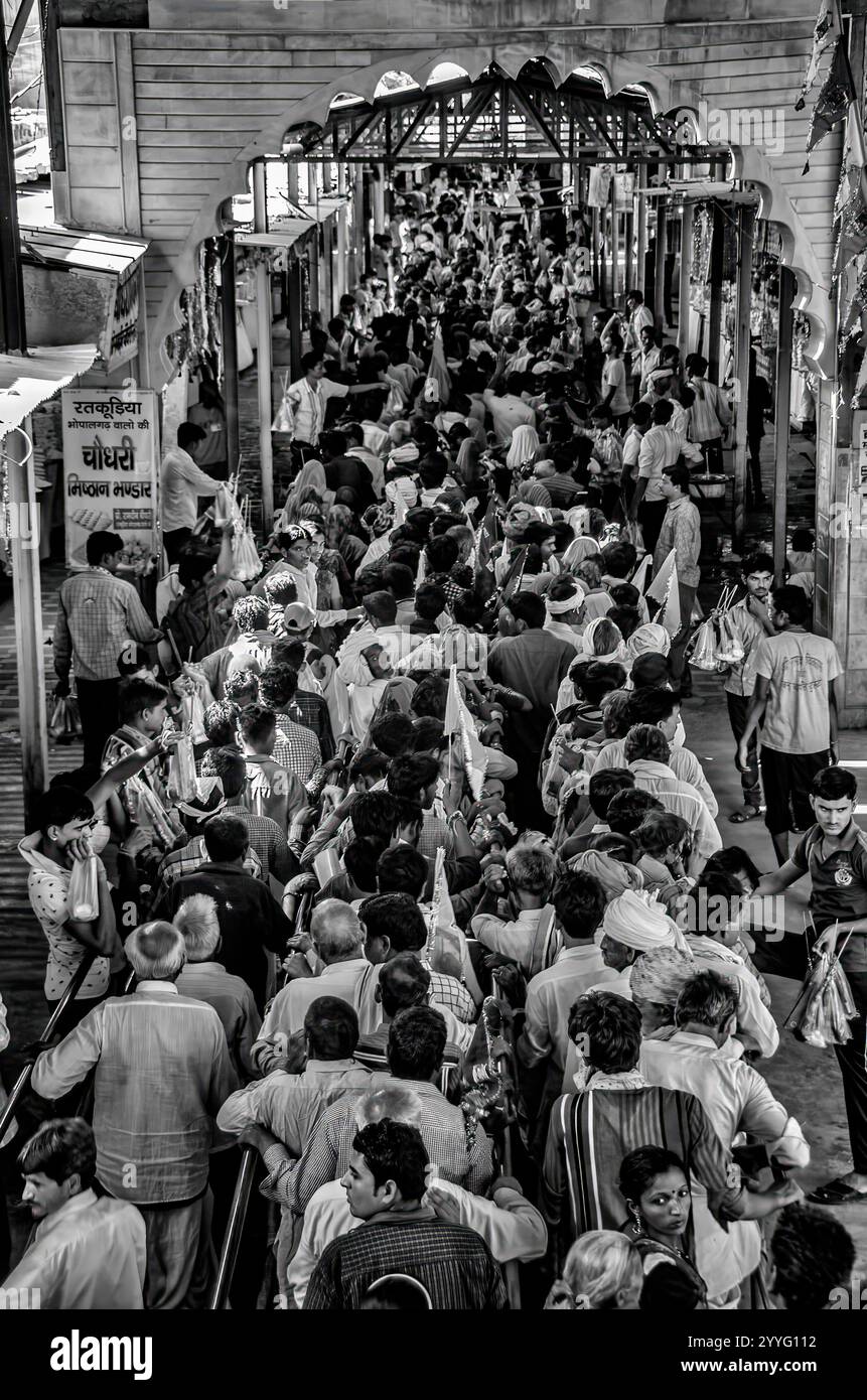 Queues of devotees at the Ramdevra fair, Ramdevra, Rajasthan, India ...