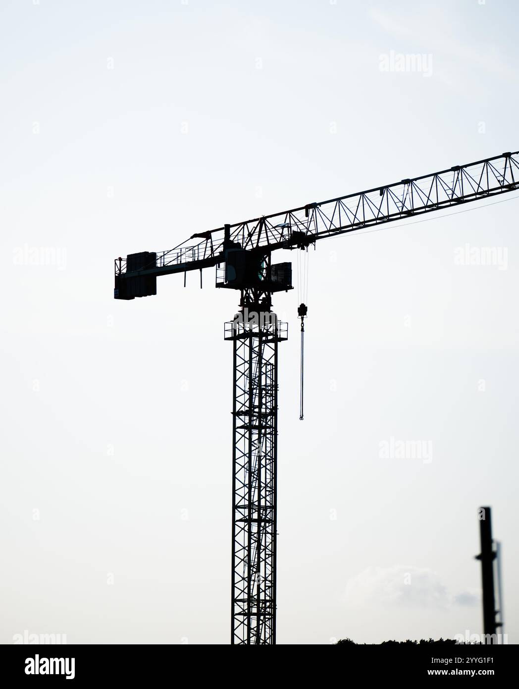 Tall construction crane at a building site Stock Photo - Alamy