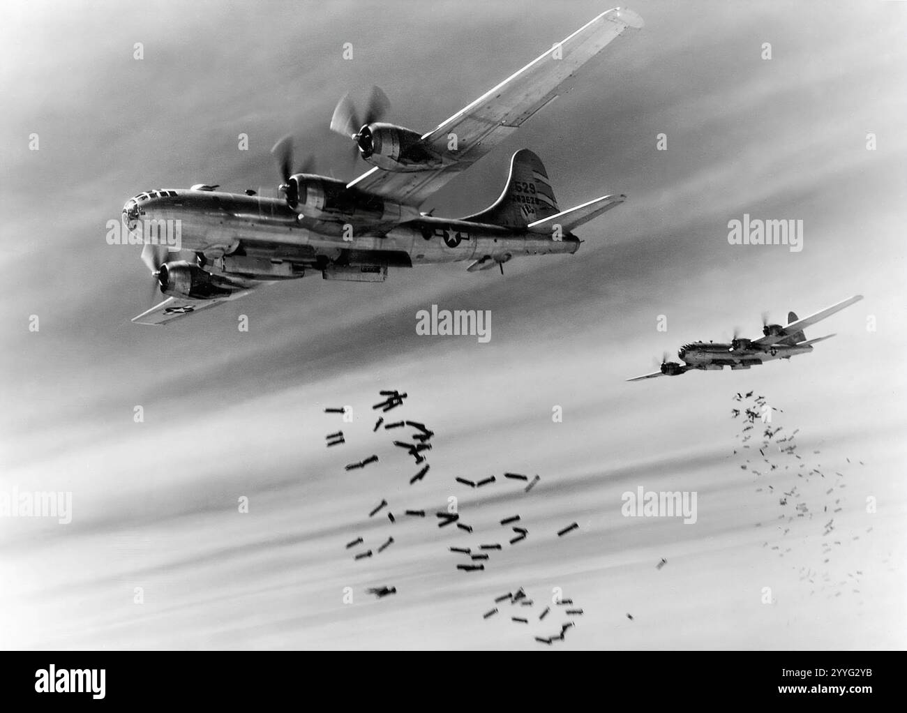 Boeing B-29s drop bombs over Rangoon, Burma. Nearest aircraft is B-29 ...