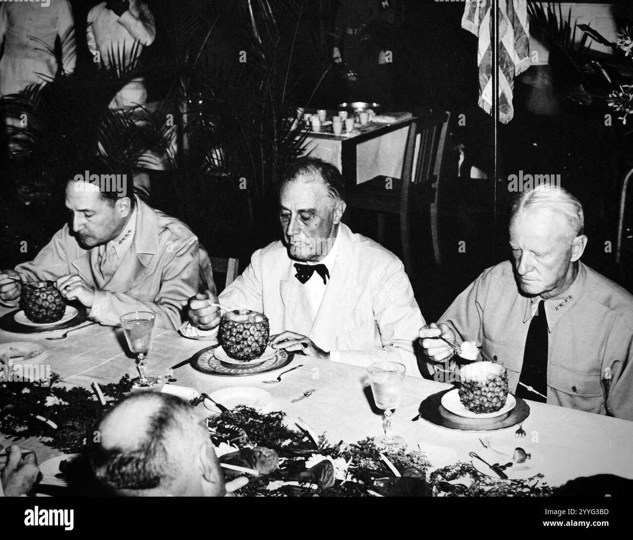 President Franklin D. Roosevelt eats pineapples with General Douglas ...