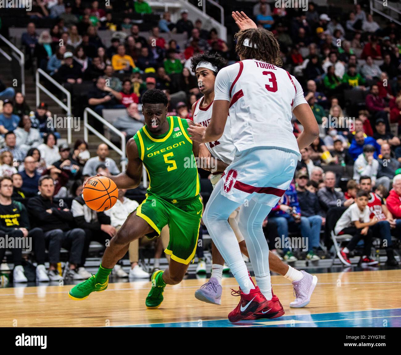December 21 2024 San Jose, CA U.S.A. Oregon guard TJ Bamba (5)goes to ...