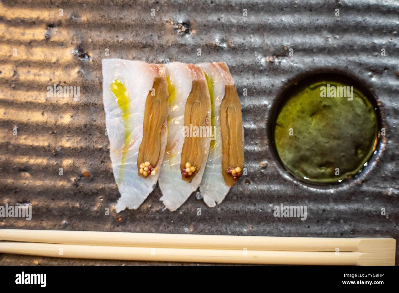 Close up Thai Fish sashimi with olive oil on the dish Stock Photo - Alamy