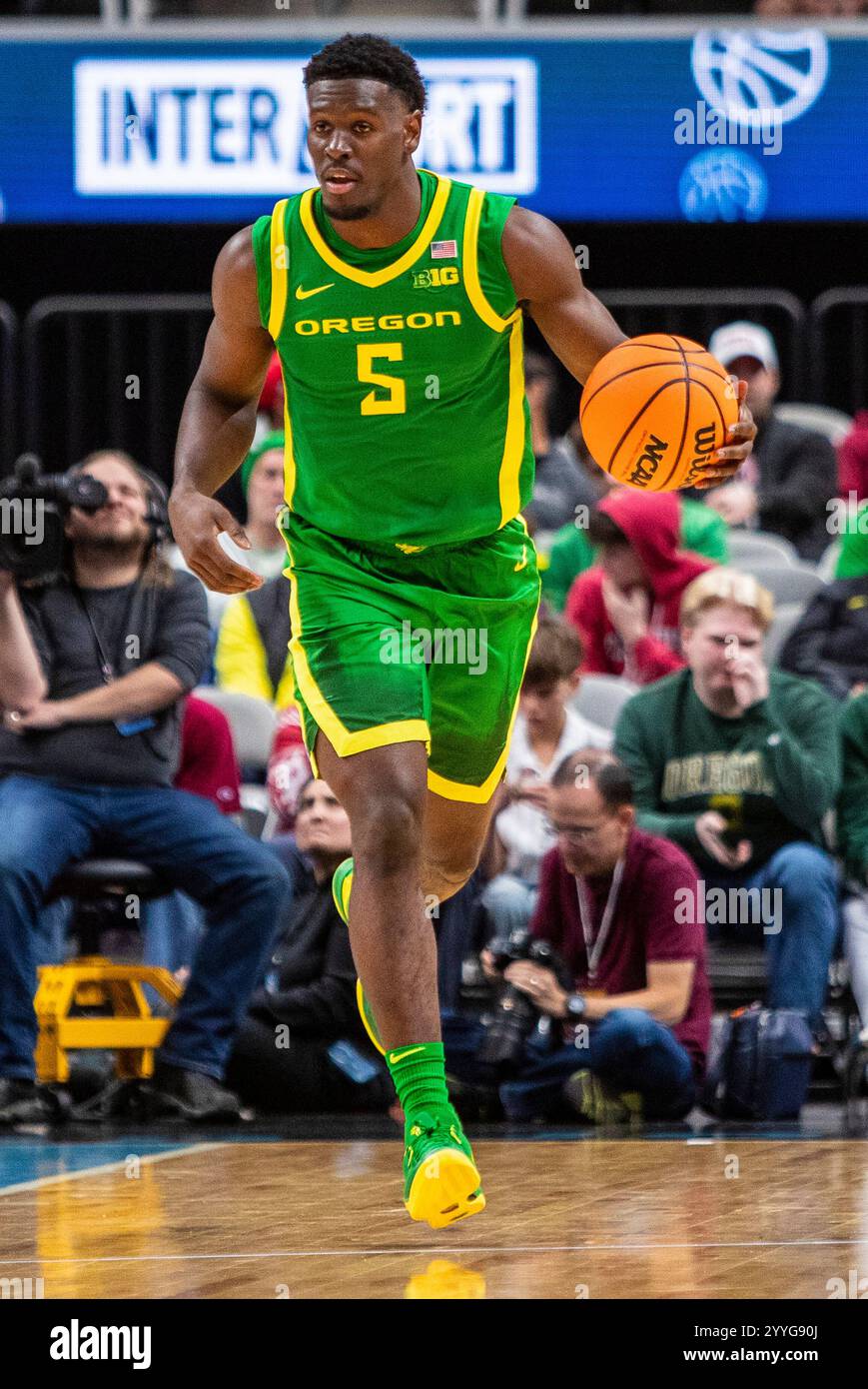 December 21 2024 San Jose, CA U.S.A. Oregon guard TJ Bamba (5)brings ...
