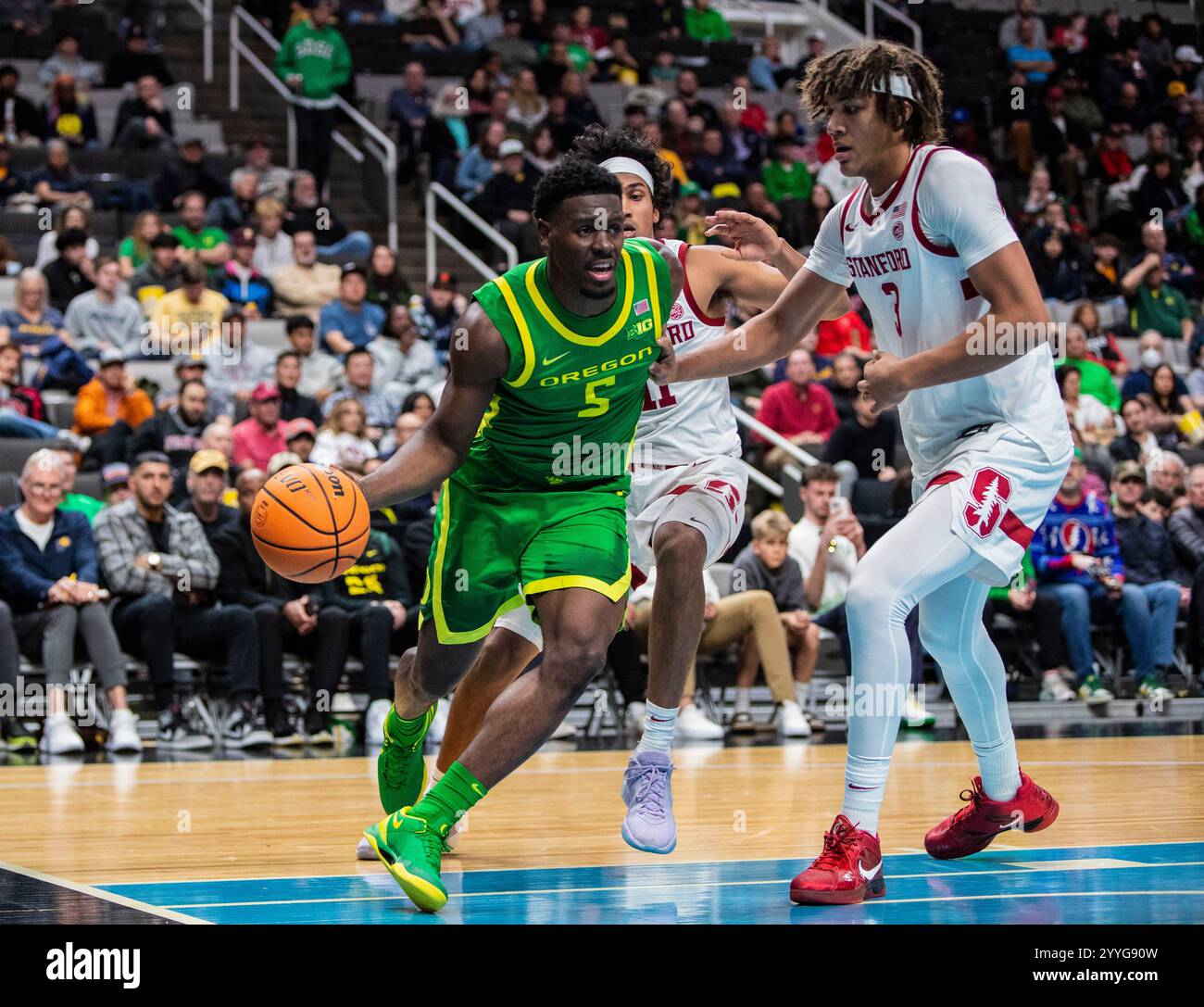 December 21 2024 San Jose, CA U.S.A. Oregon guard TJ Bamba (5)drives to ...