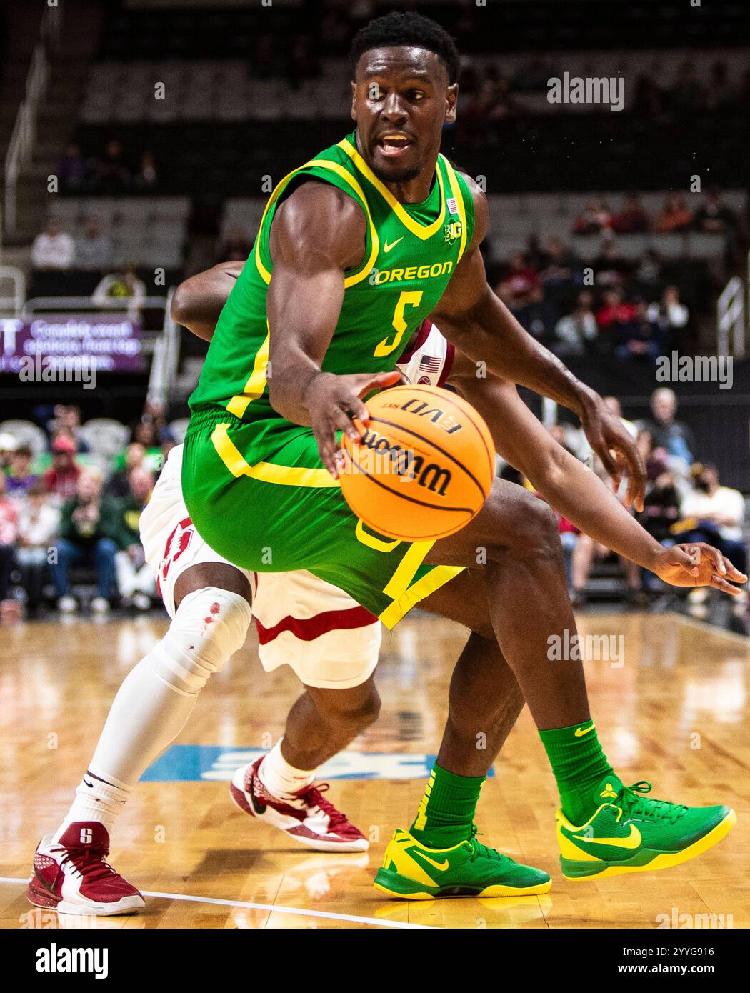 December 21 2024 San Jose, CA U.S.A. Oregon guard TJ Bamba (5)drives to ...