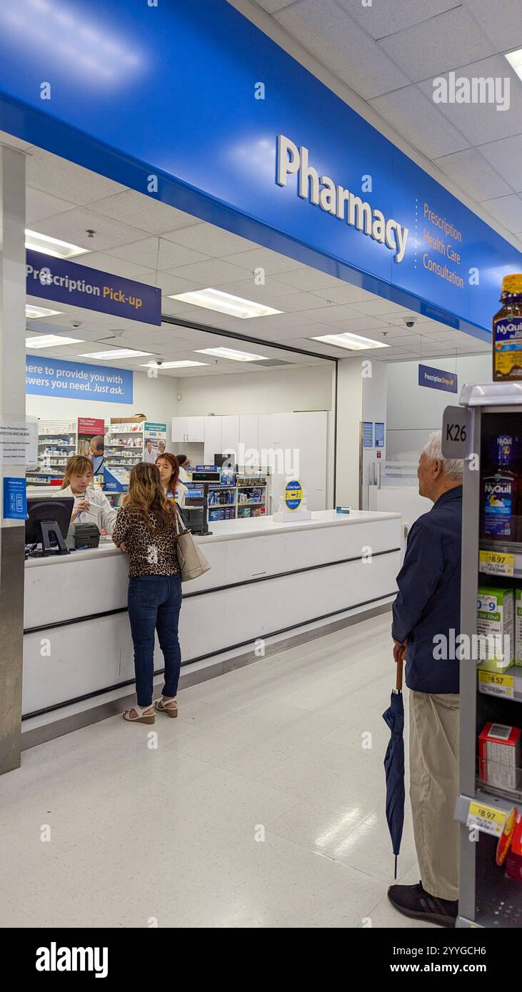 Pharmacy Counter at Walmart: Customer Receiving Prescription from ...