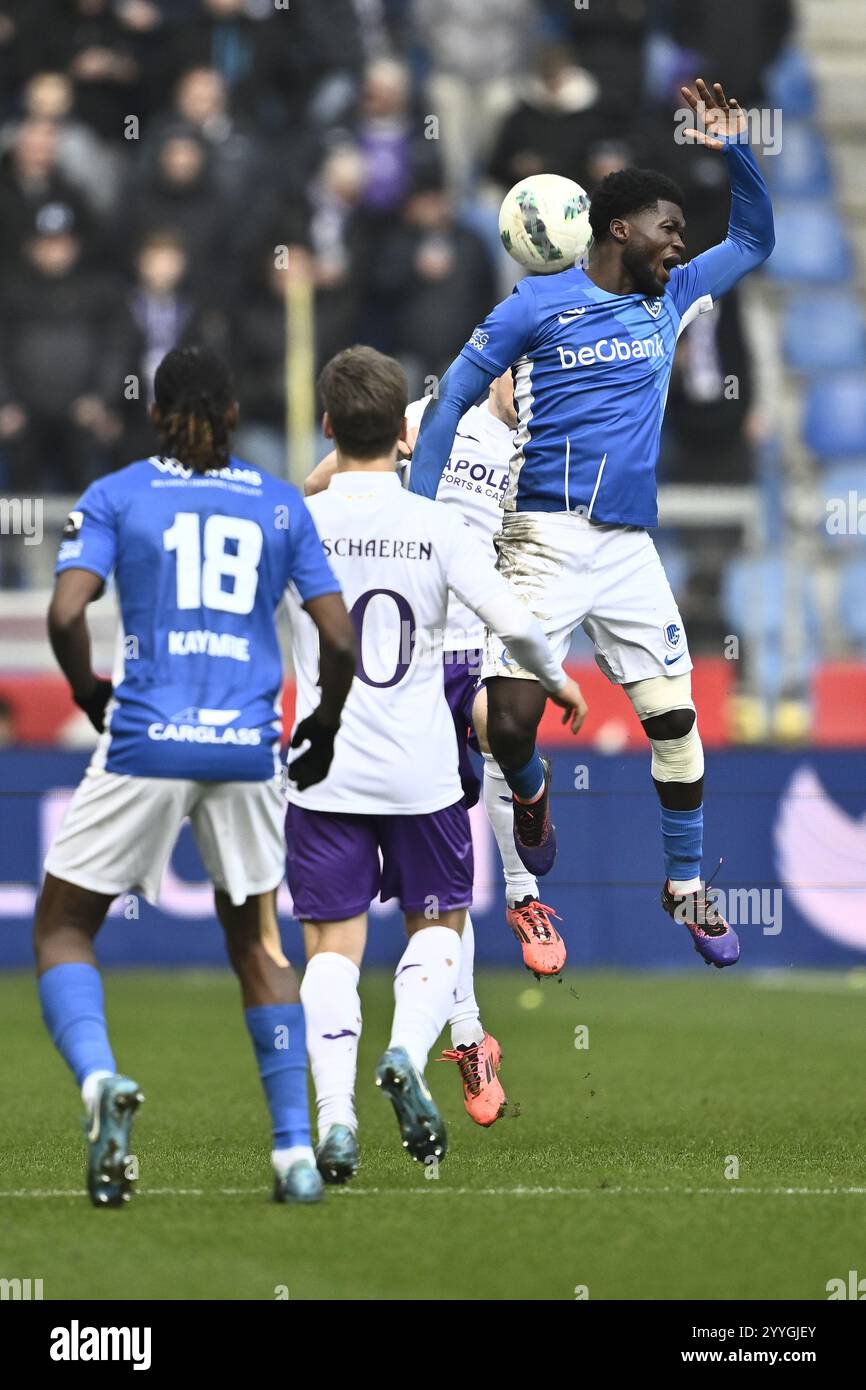 Genk, Belgium. 22nd Dec, 2024. Genk's Christopher Bonsu Baah fights for ...