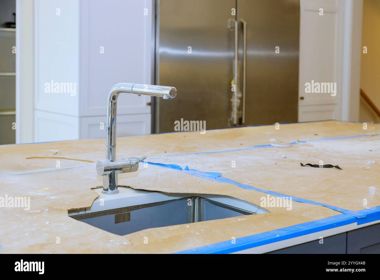 Kitchen under renovation features complete countertop with cutout for ...