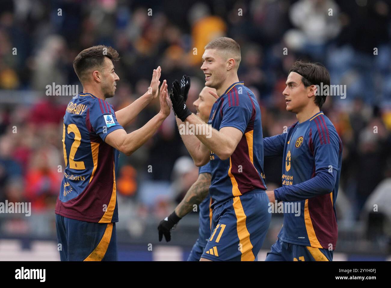 Roma's Artem Dovbyk, center celebrates after scoring his side's fifth ...
