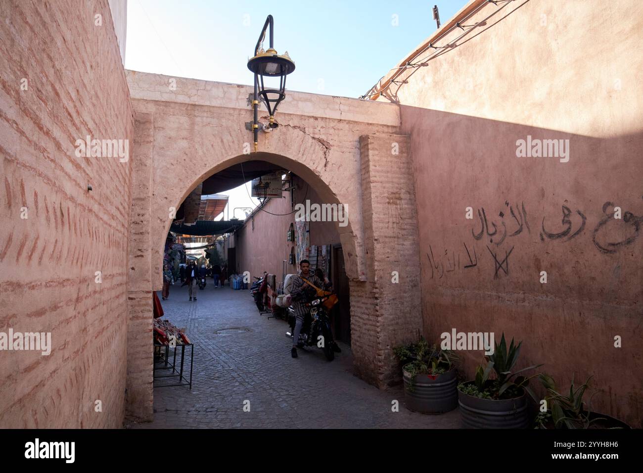archway and street lighting in narrow alley of the medina rue riad ...