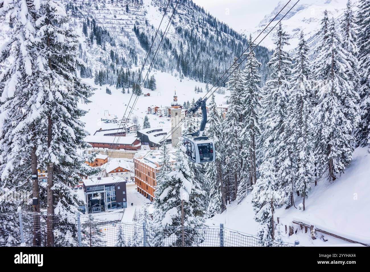 Lech: winter in Lech, church Lech, cable car Oberlech in Arlberg ...