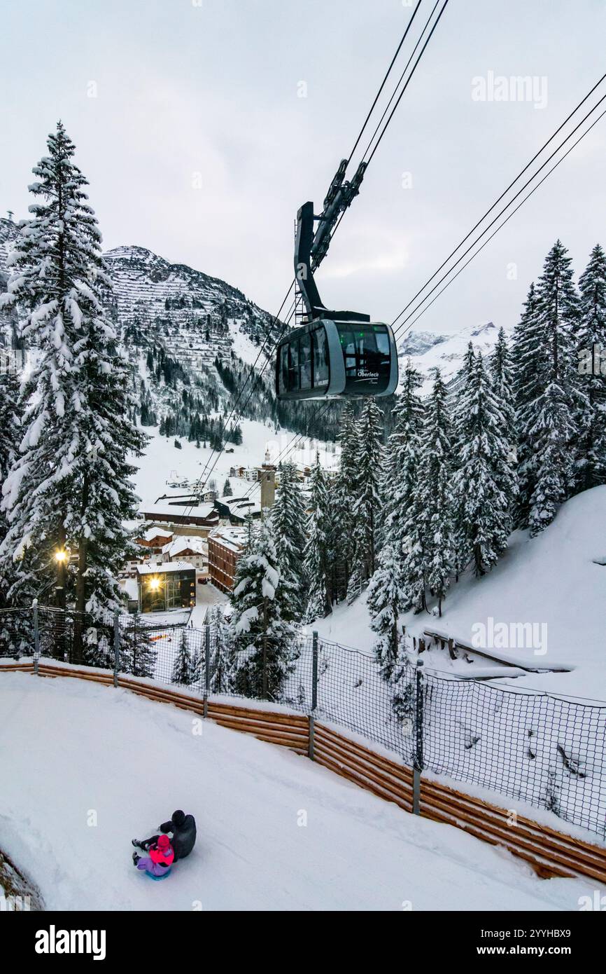 Lech: winter in Lech, church Lech, cable car Oberlech, sledder, sled in ...