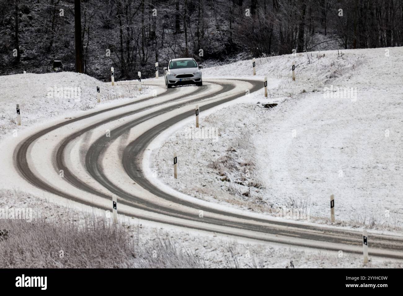 Hohenstein, Germany. 22nd Dec, 2024. A car is traveling on the Swabian ...