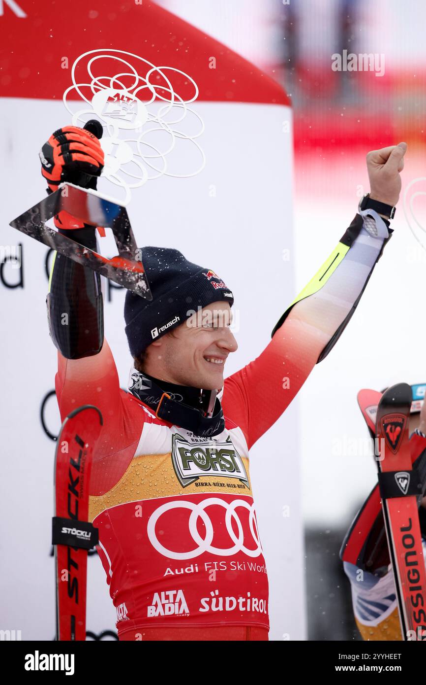 Switzerland's Marco Odermatt celebrates on the podium after winning an ...