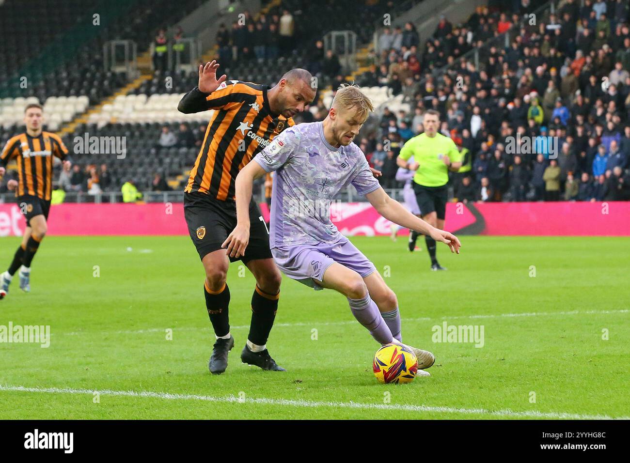 MKM Stadium, Hull, England - 21st December 2024 Harry Darling (right) of Swansea City under ...