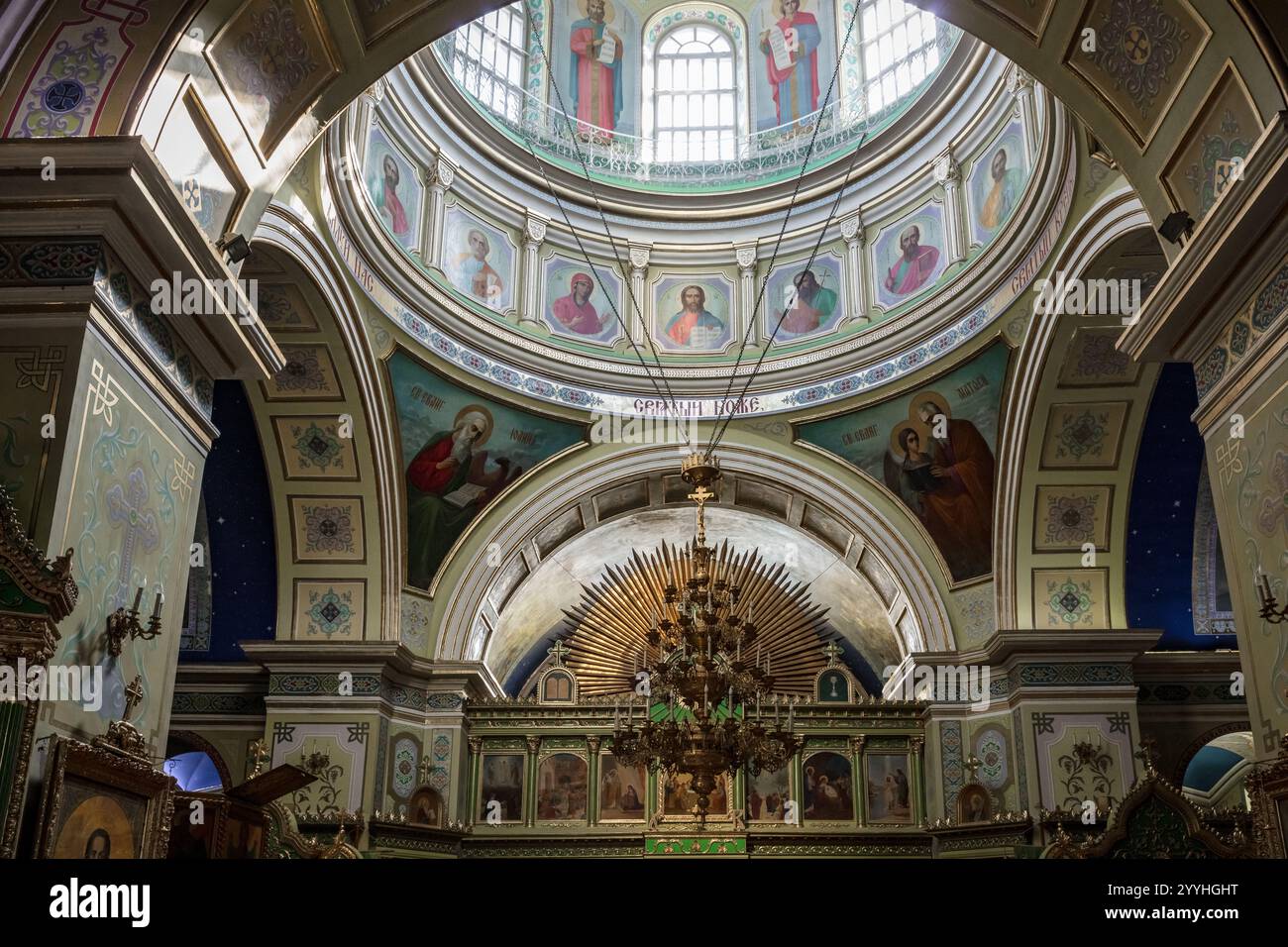 The inside of a church with a large dome and many paintings on the ...