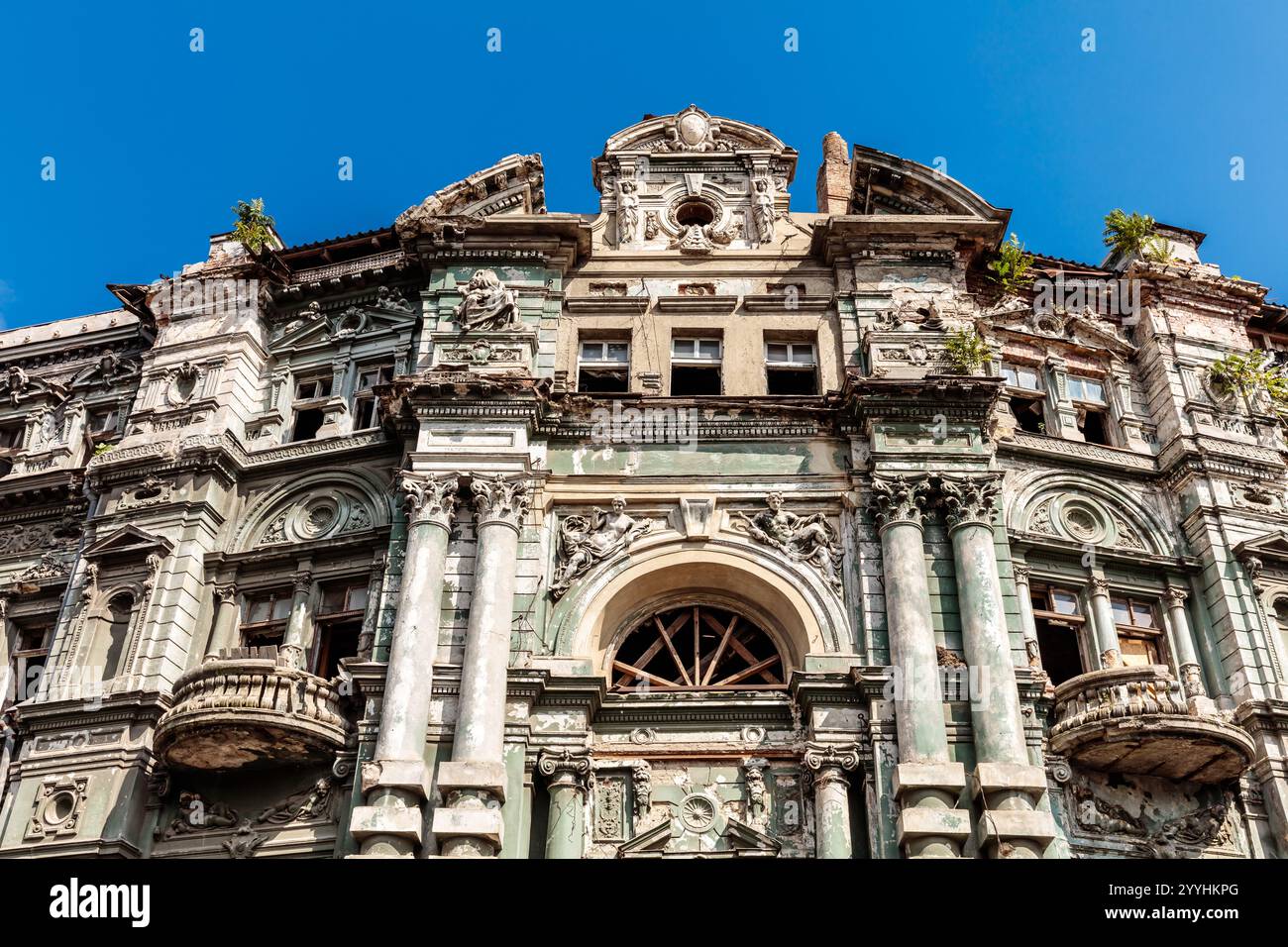 The building is old and has a lot of damage. The windows are broken and ...