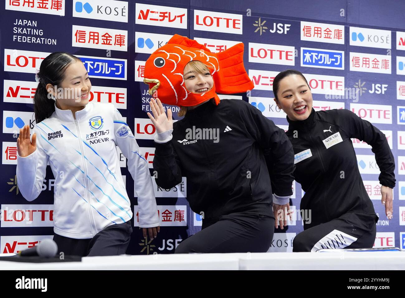 Kaori Sakamoto (C) poses after winning gold in the women's event at the ...