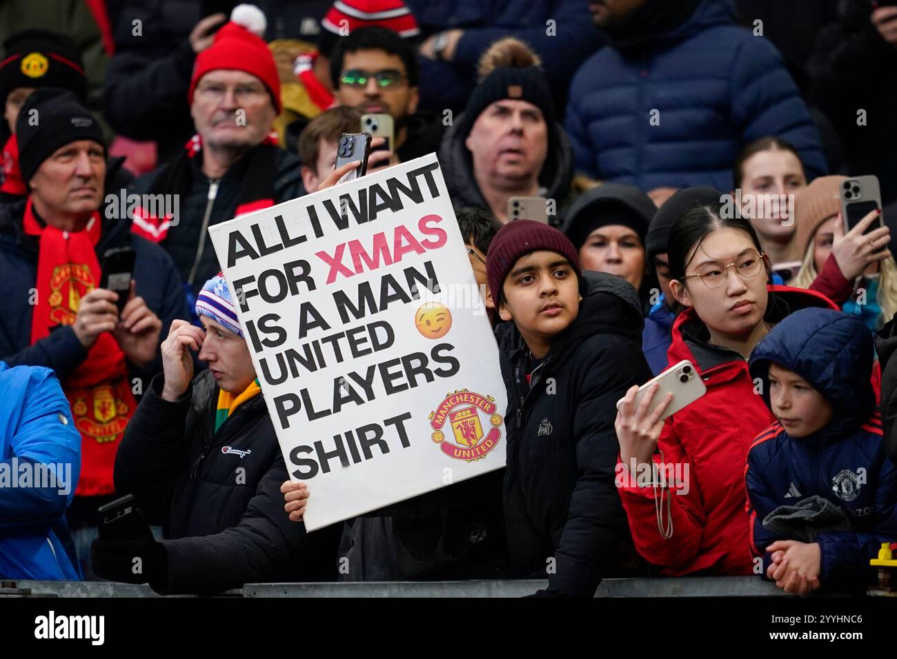 Fans hold banners during the English Premier League soccer match ...